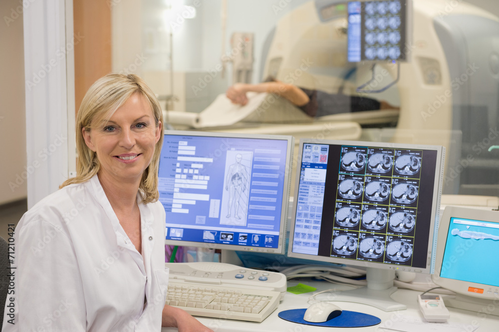 Female doctor smiling in medical MRI scan monitor room Stock Photo ...