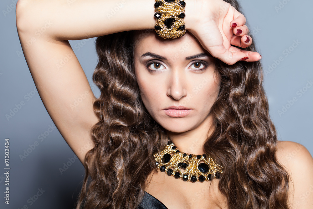 Fashion model with long curly hair. Fashion model in studio Stock Photo ...
