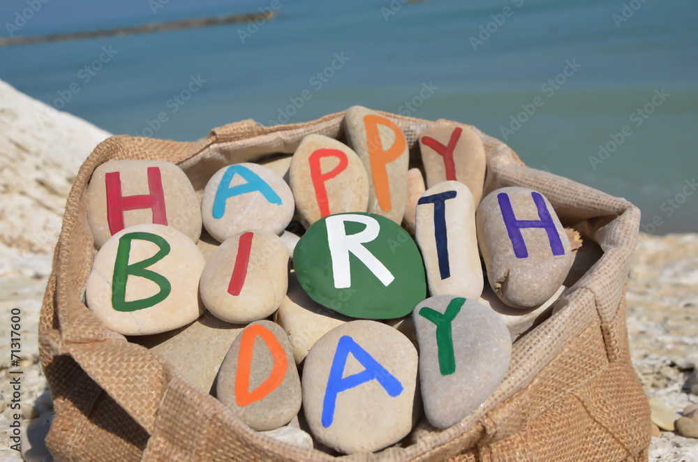 Happy Birthday composition of stone letters in a bag Stock Photo ...