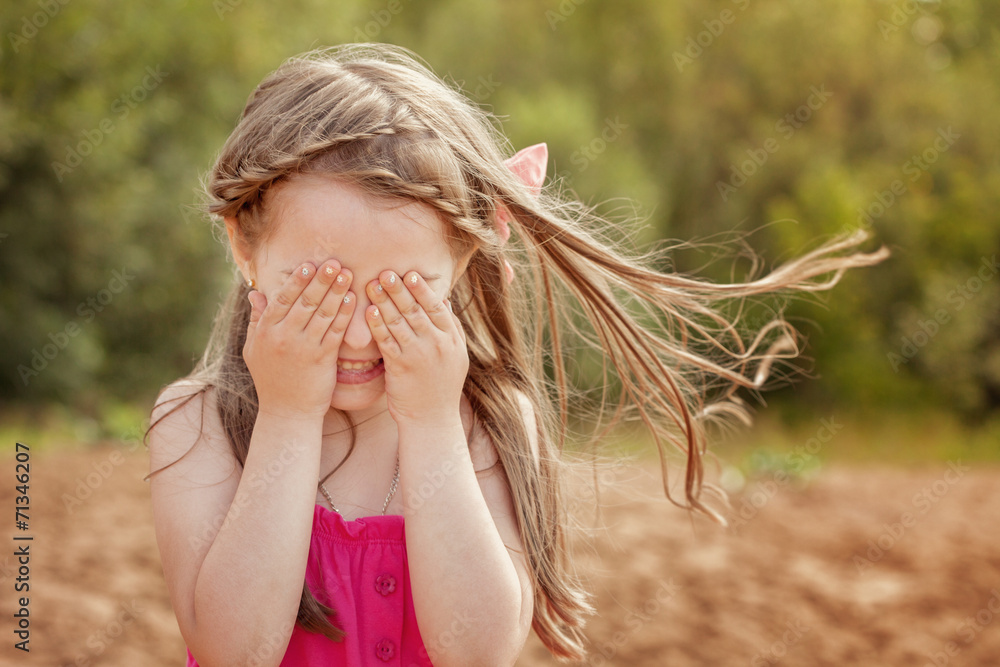 Cute little girl playing hide and seek with camera Stock Photo | Adobe ...