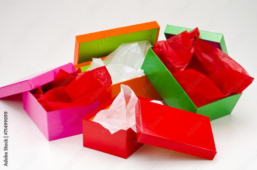 Four open gift boxes. Stock Photo | Adobe Stock