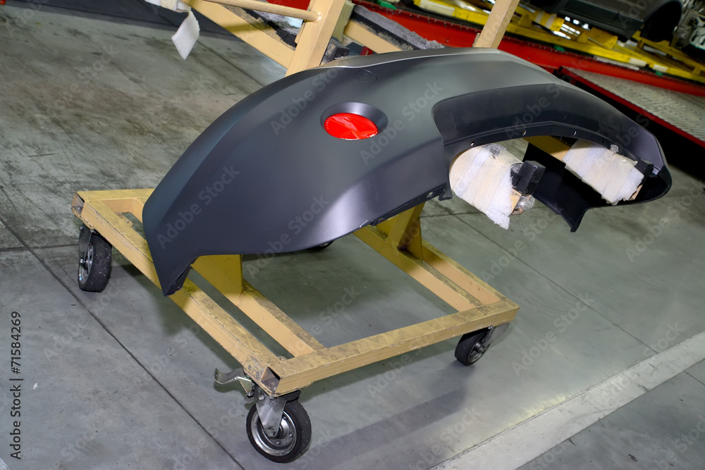 Rear bumper of a body of the car on supports in assembly shop of Photos ...