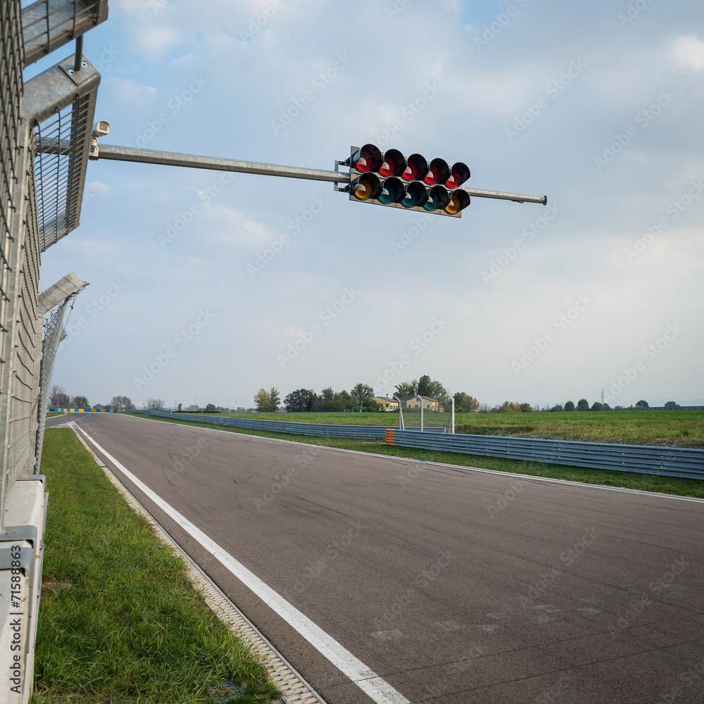 Empty formula one circuit with traffic lights. Stock Photo | Adobe Stock