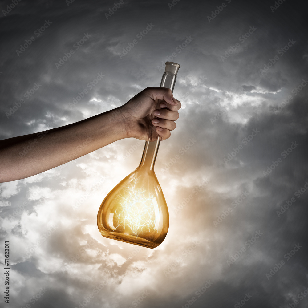 Hand holding tube Stock Photo | Adobe Stock