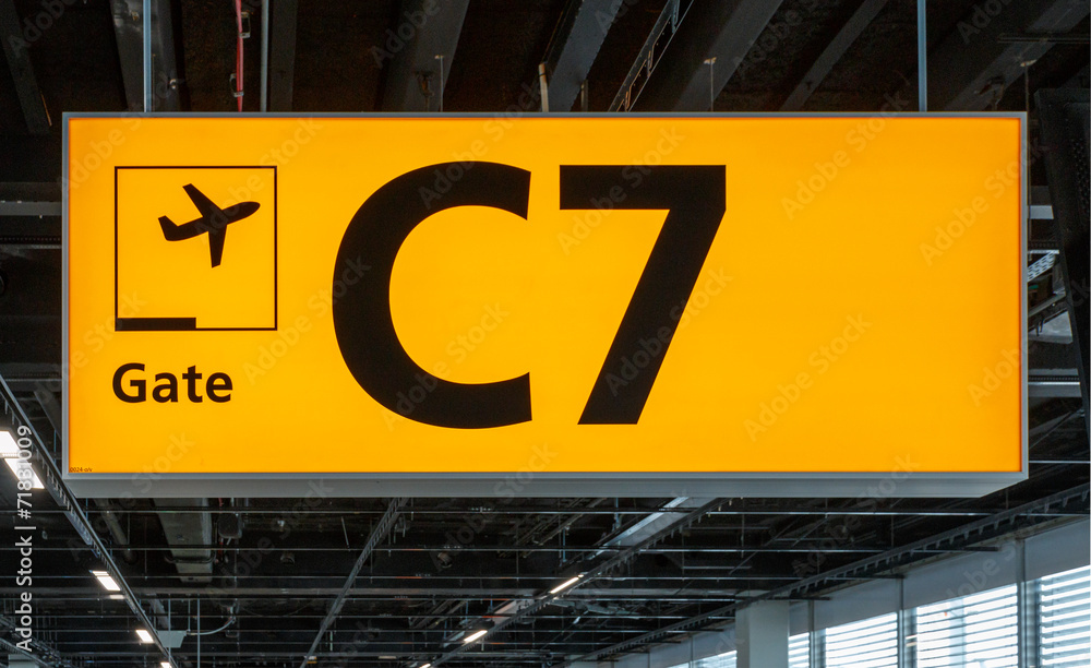 Illuminated sign at airport with gate number Stock Photo | Adobe Stock