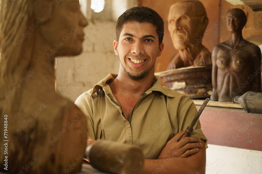 Portrait man working happy artist art wood sculpture in atelier Stock ...