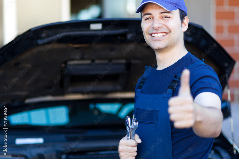 Smiling mechanic thumbs up Stock Photo | Adobe Stock