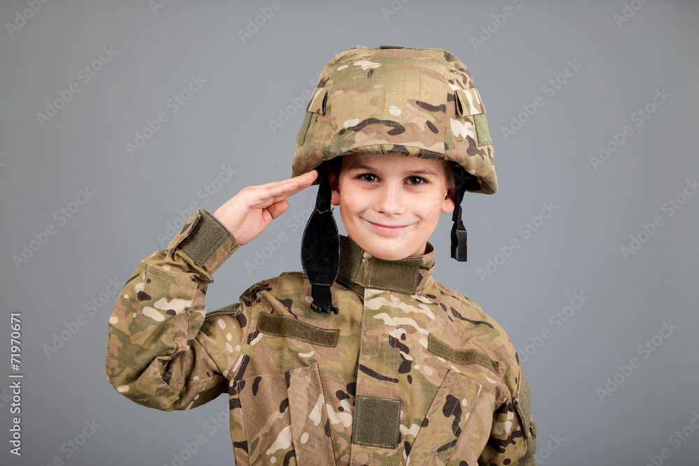 Saluting soldier. Young boy dressed like a soldier Stock Photo | Adobe ...