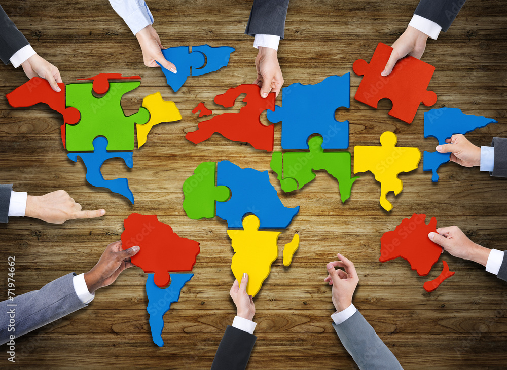 People Forming World Map with Puzzle Pieces Stock Photo | Adobe Stock