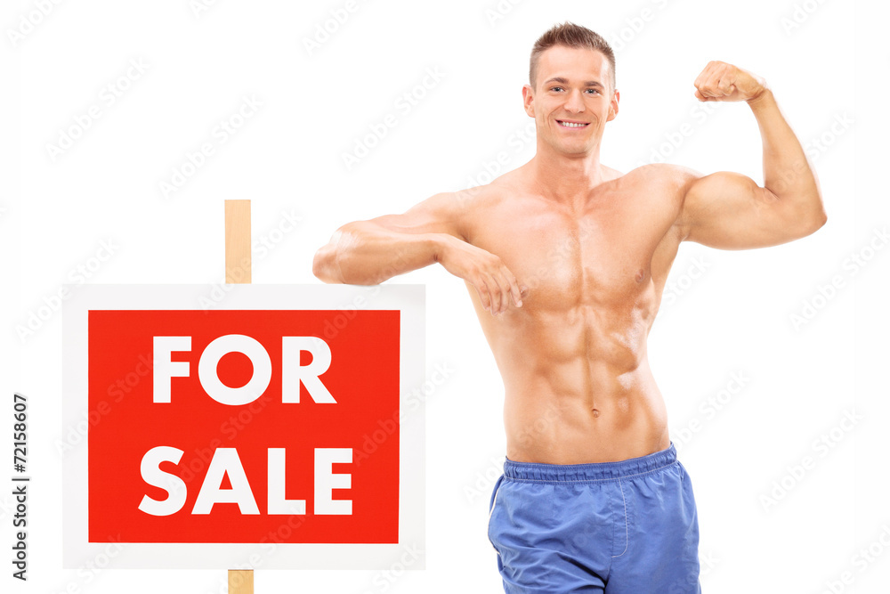 Handsome man standing by a for sale sign Stock Photo | Adobe Stock