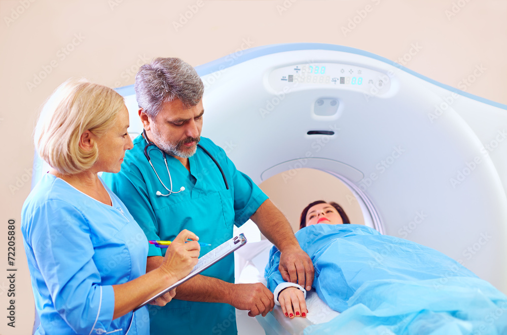 medical staff preparing patient to CT scanner procedure Stock Photo ...