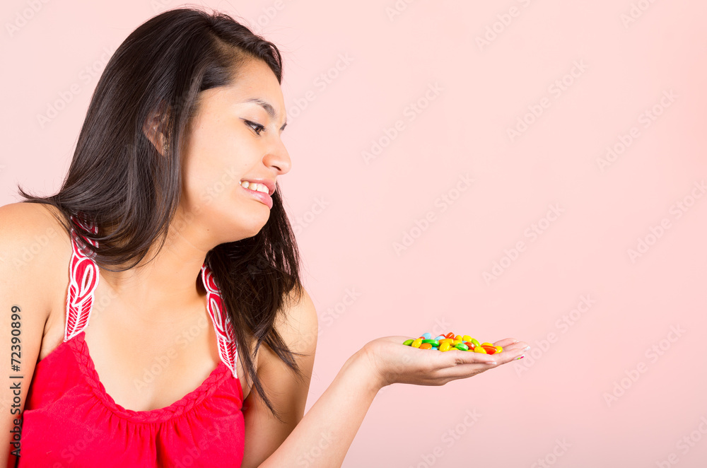 Pretty young teenage girl student looking at candy sweets Stock Photo ...