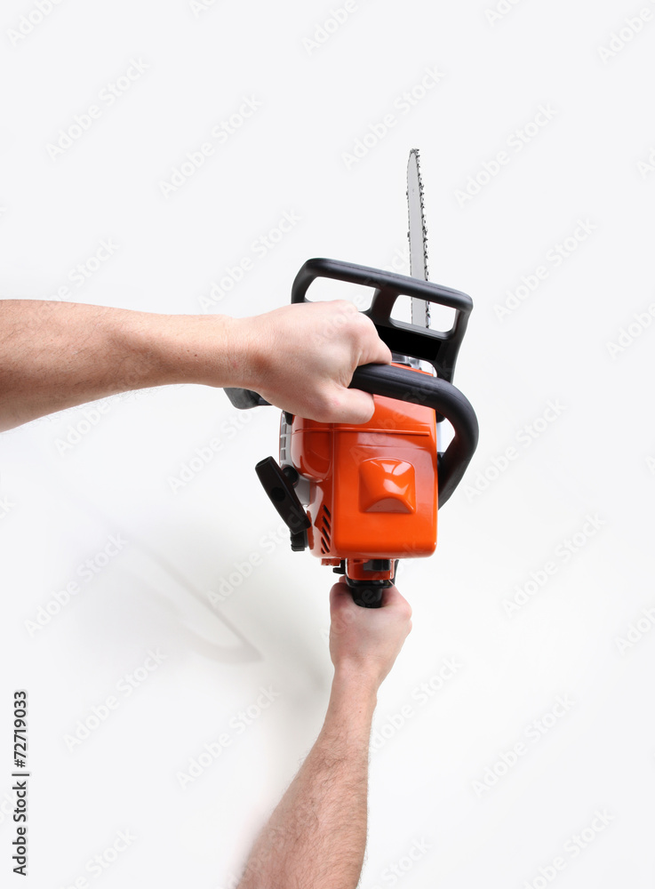 man hands holding a chainsaw Stock Photo | Adobe Stock