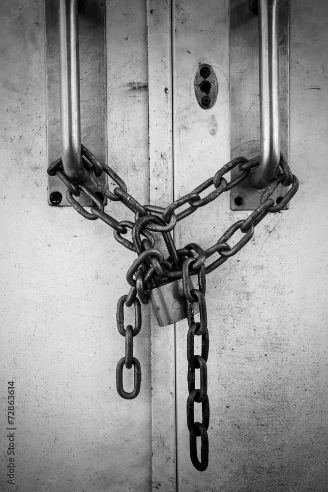 Iron lock and chain on an old door Stock Photo | Adobe Stock