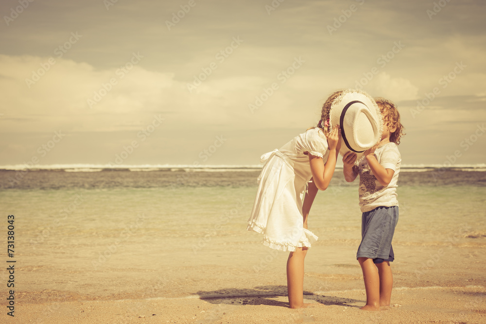 happy kids playing on beach at the day time Stock Photo | Adobe Stock