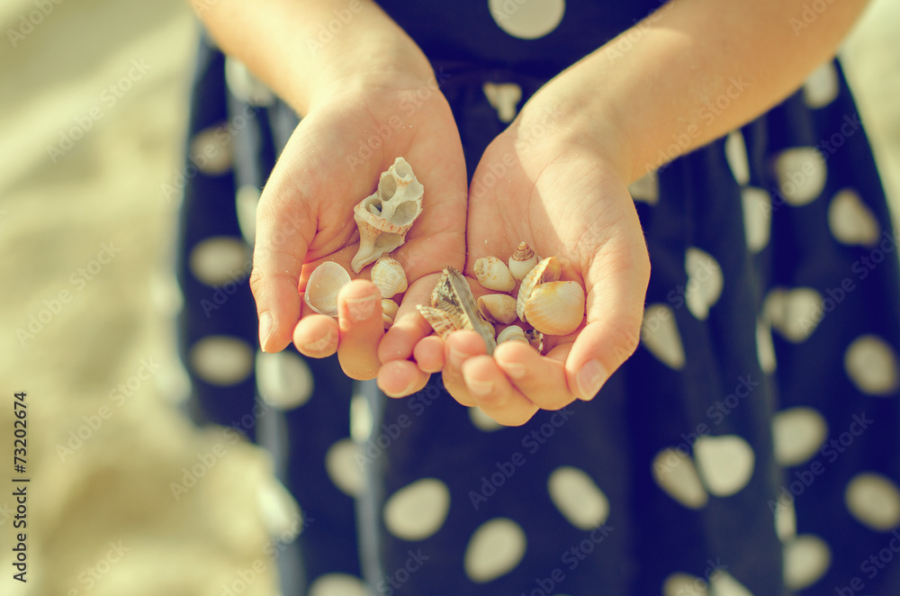 Child hands holding sea shells. Vintage effect photo. Stock Photo ...