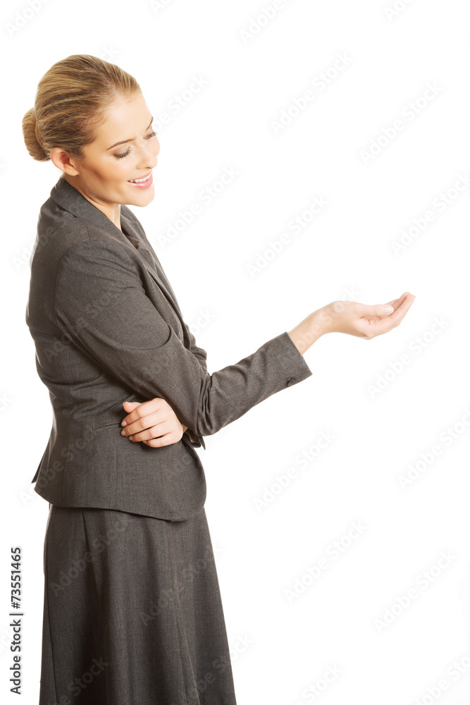 Woman holding something on her hand Stock Photo | Adobe Stock