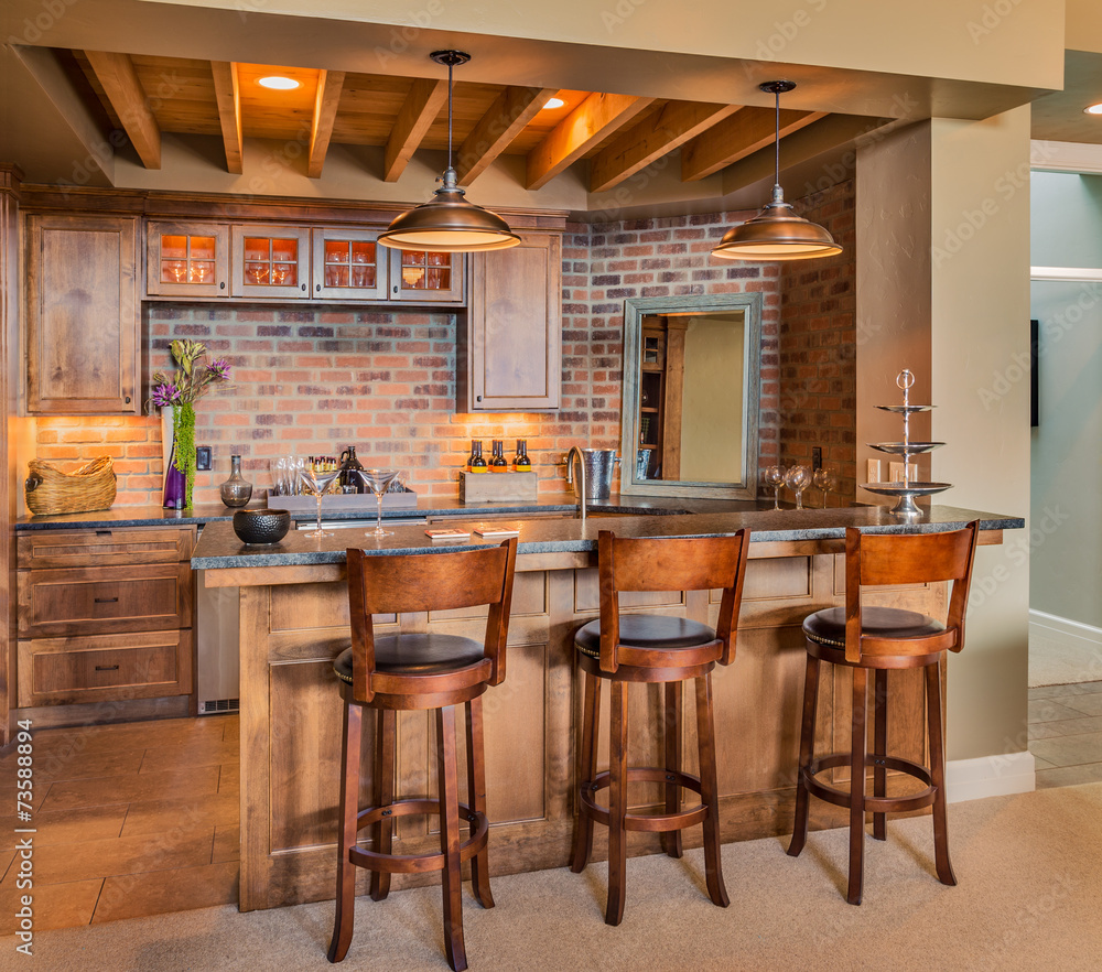 Bar complete with charis, wine glasses, beer, and new cabinets Stock ...