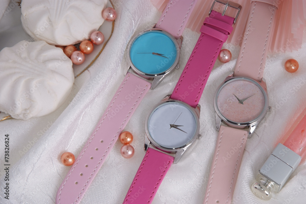 colorful watches on pink girlish background Stock Photo | Adobe Stock
