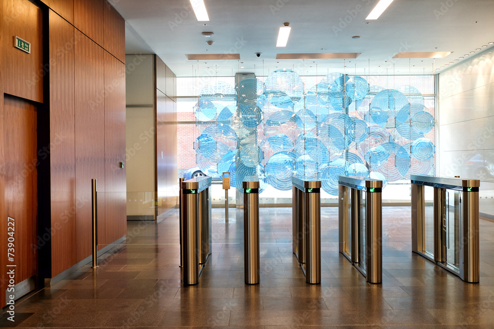 Secure entrance , exit gates to a building Stock Photo | Adobe Stock
