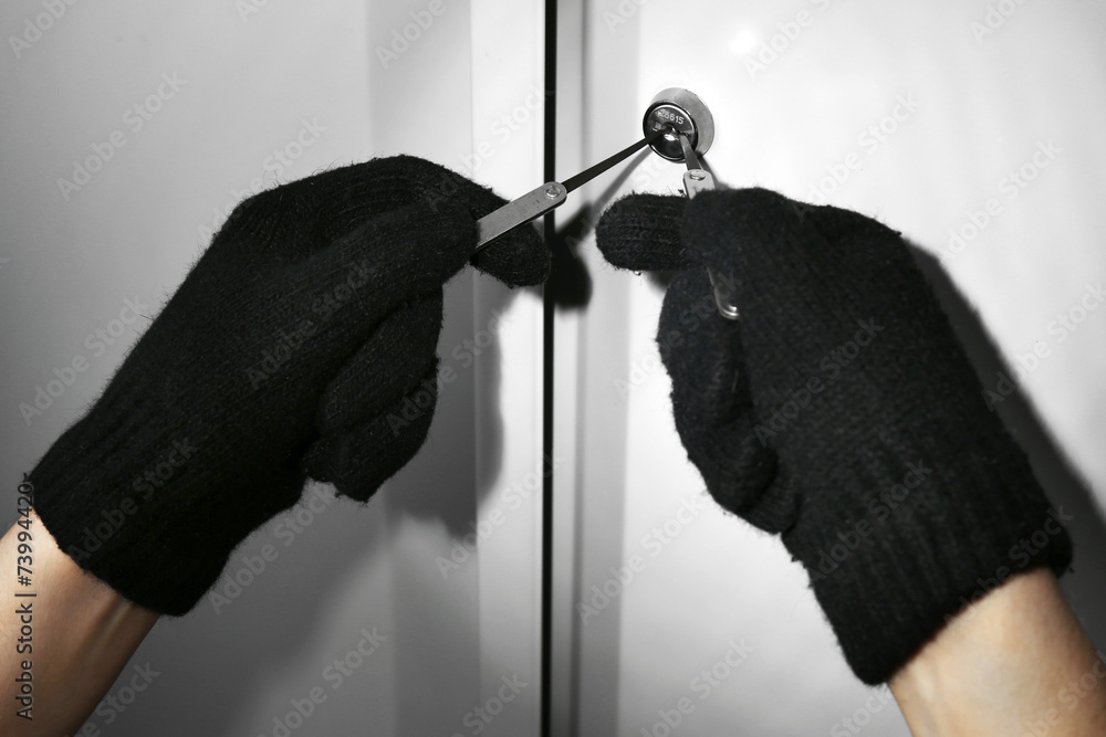 Picking a lock Stock Photo | Adobe Stock