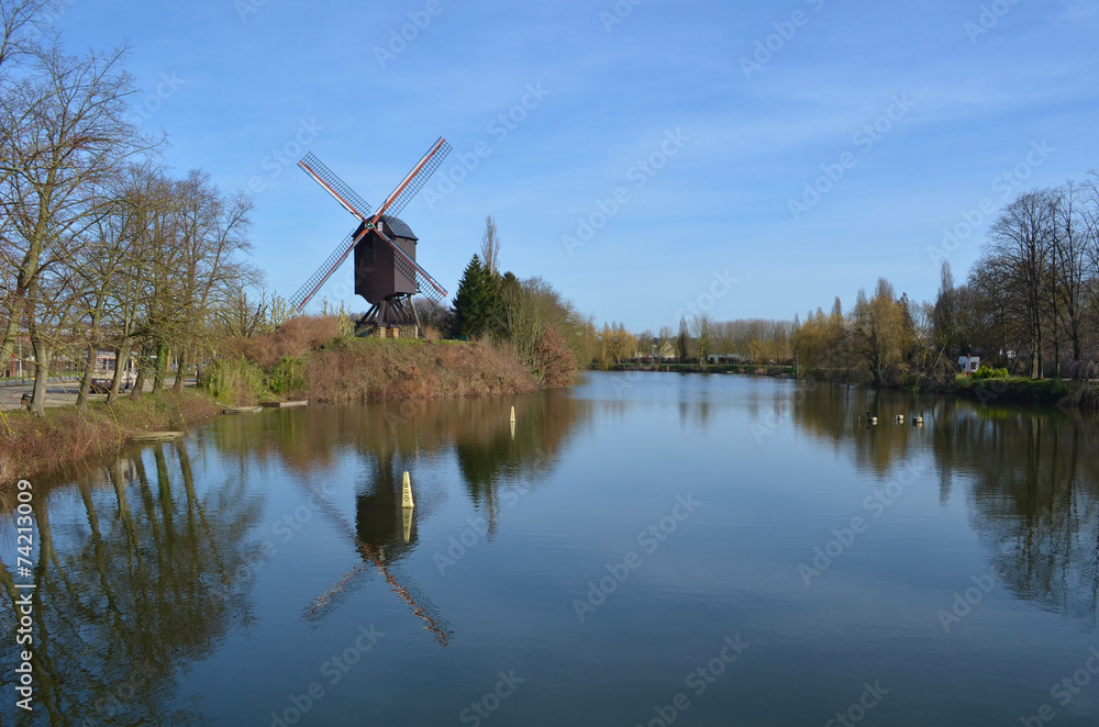windmill reflected on the water surface Stock Photo | Adobe Stock