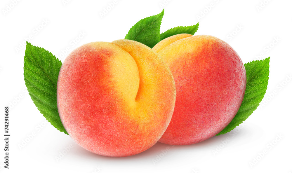 Isolated peaches. Two fresh peaches with leaves over white background ...