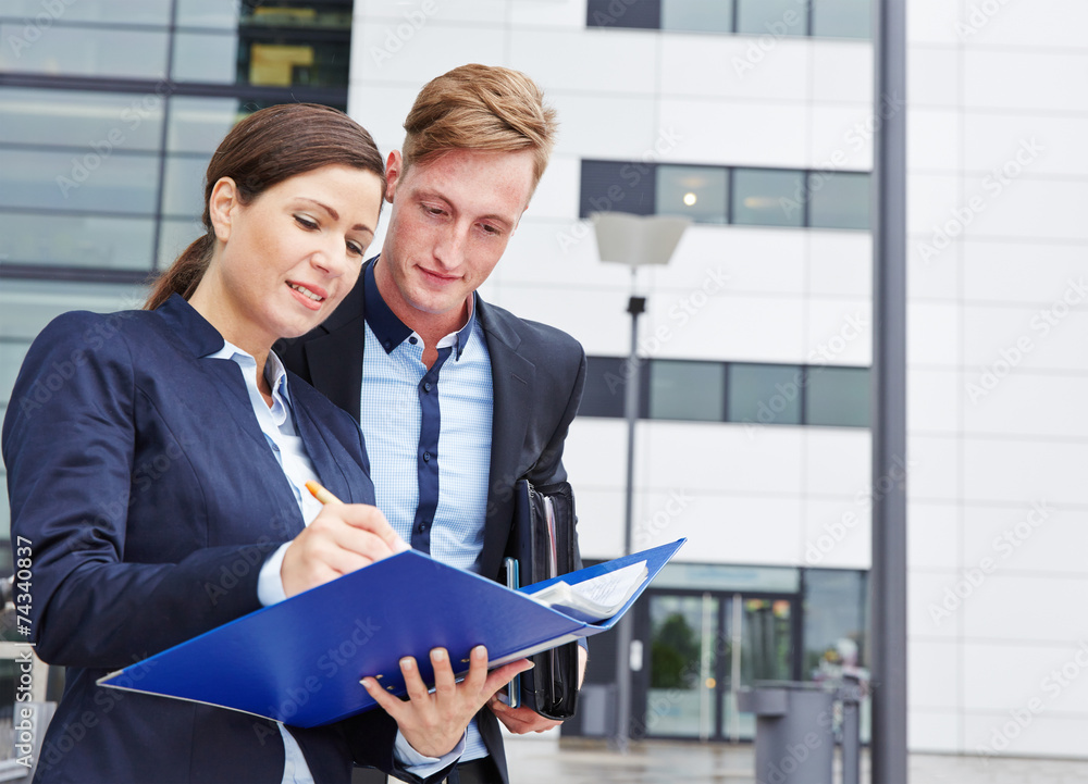 Two business people checking files Stock Photo | Adobe Stock