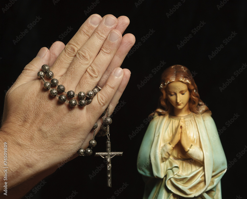 Praying hands with a rosary and the virgin mary Stock Photo | Adobe Stock