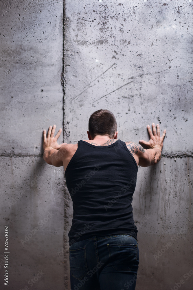 Man pushing the wall Stock Photo | Adobe Stock Man pushing the wall Stock Photo | Adobe Stock