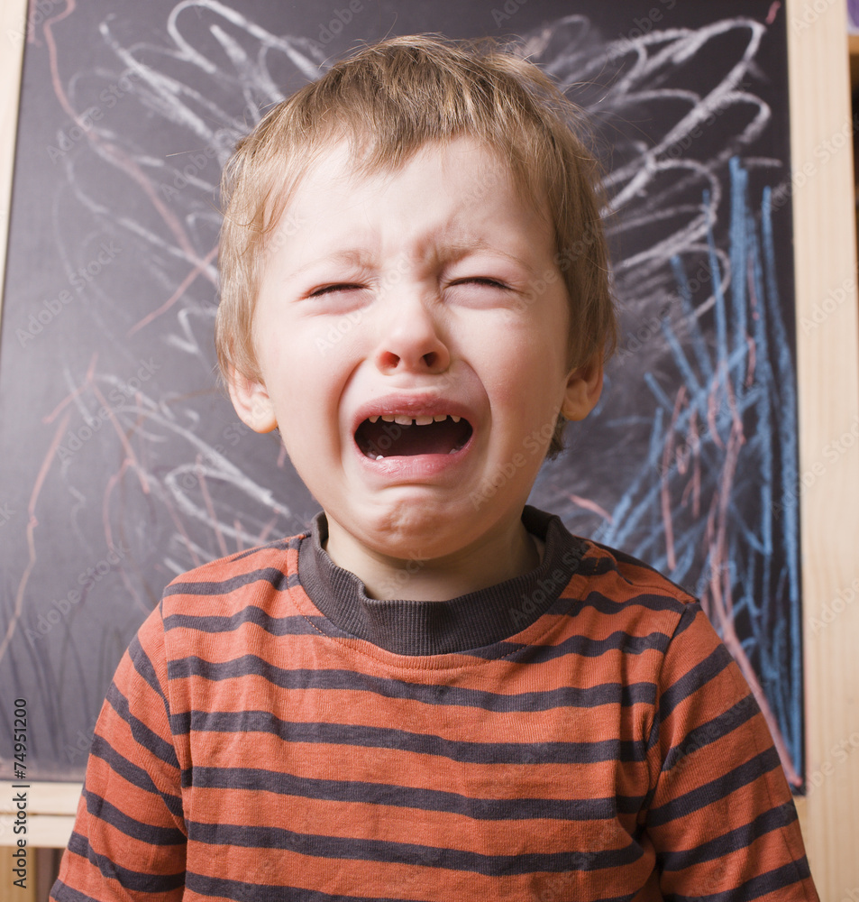little cute boy screaming and crying at school Stock Photo | Adobe Stock
