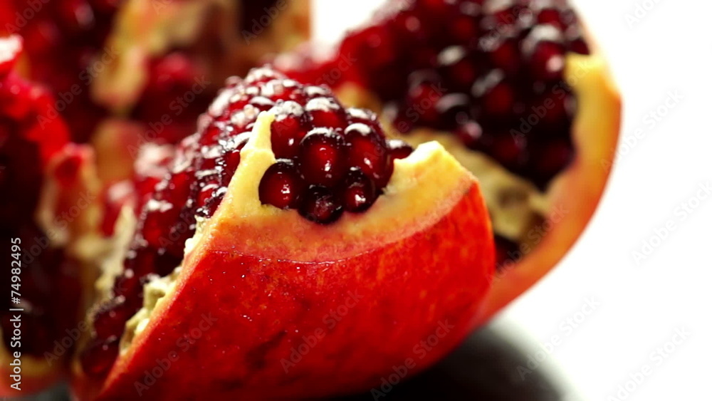 open pomegranate rotates on a light background Stock Video | Adobe Stock