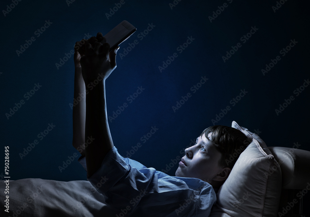 Reading in bed Stock Photo | Adobe Stock