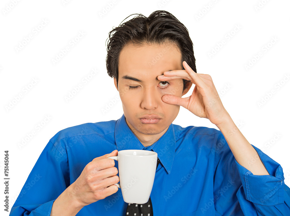 Foto de tired falling asleep young businessman holding cup of coffee do ...