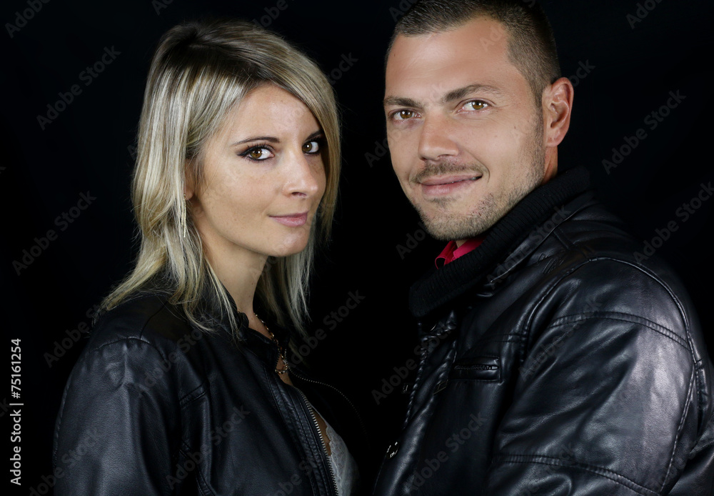 Rebel young couple dressed in a black leather jacket Stock Photo ...