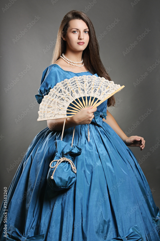 Beautiful woman wearing blue elegant costume Stock Photo | Adobe Stock