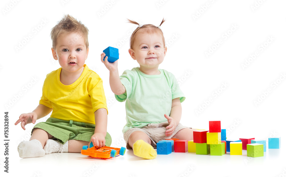 Adorable children playing colorful toys isolated Stock Photo | Adobe Stock