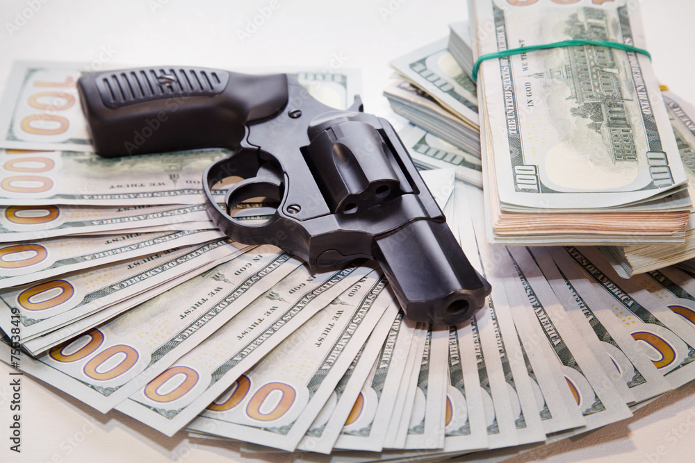 Money On Table With Gun