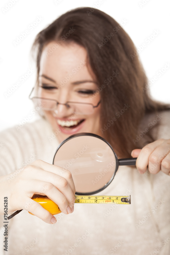 woman laughed at the size shown on the measuring tape Stock Photo ...
