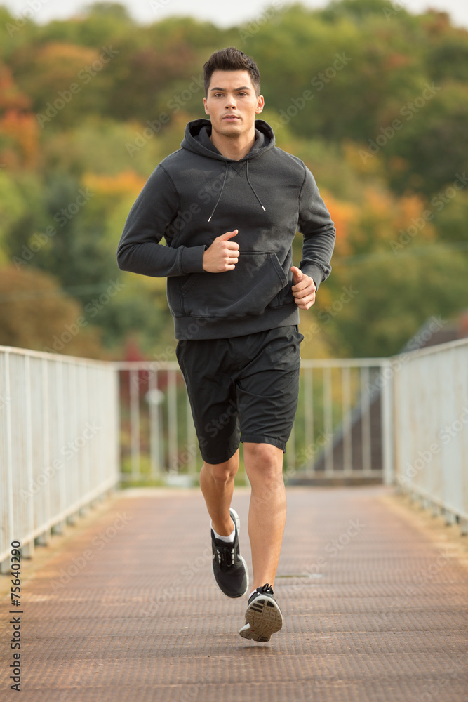 Junger Mann beim Sport draussen Stock Photo | Adobe Stock