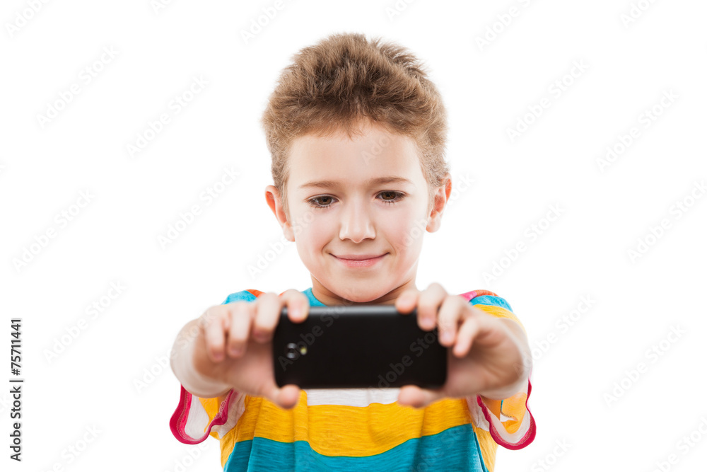 Smiling child boy holding mobile phone or smartphone taking self Stock ...