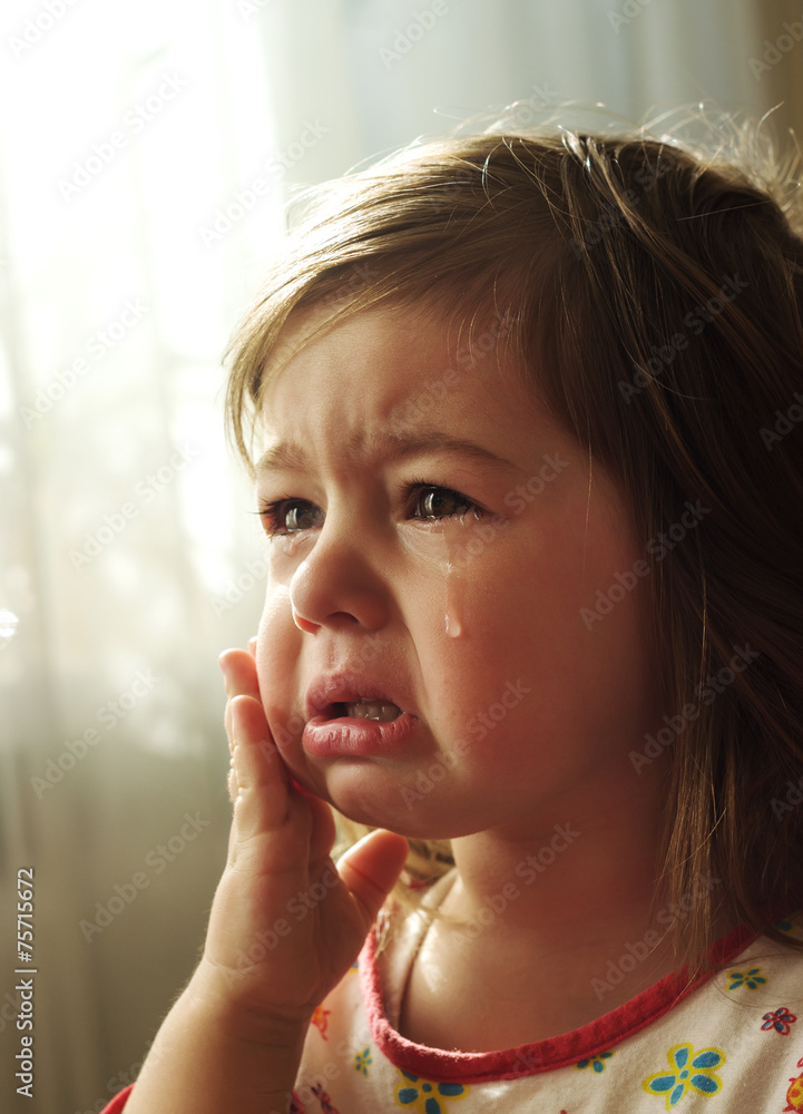 Cute little child is crying Stock Photo | Adobe Stock