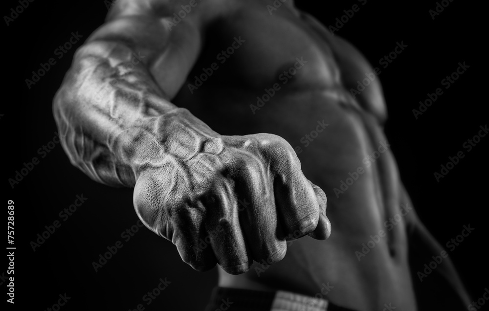 Handsome muscular bodybuilder demonstrates his fist and vein Stock ...