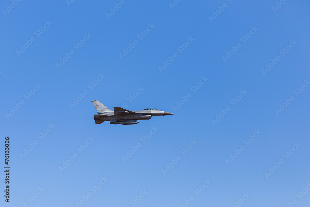 f16 falcon fighter jet flying on blue sky background Stock Photo ...