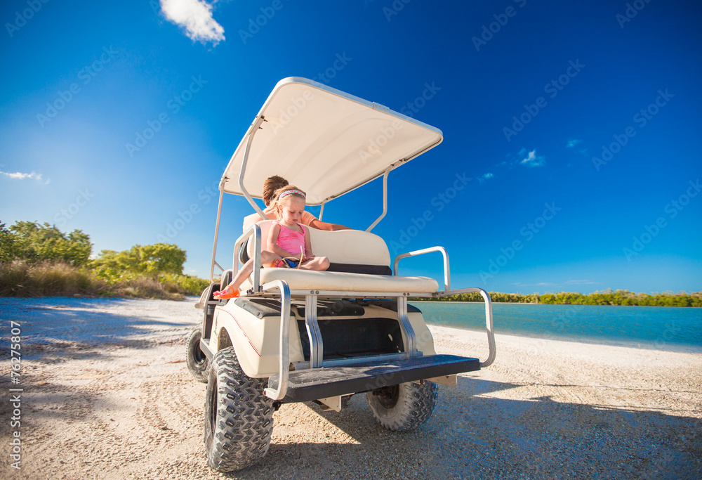 Little girl with father golf cart on tropical beach Stock Photo | Adobe ...