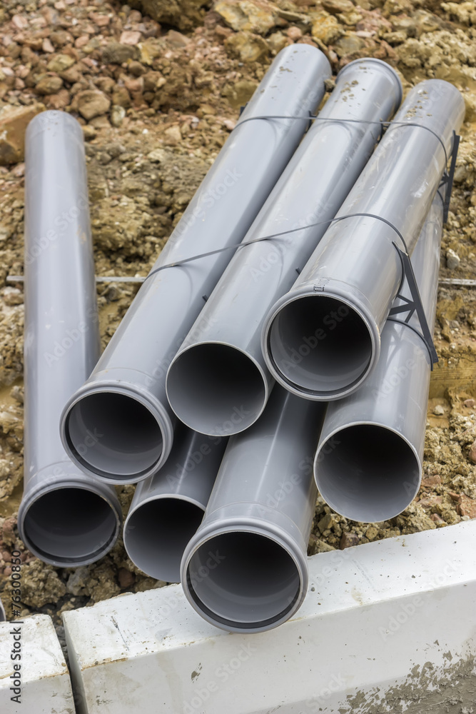 Stacks of pvc pipes at construction site Stock Photo | Adobe Stock