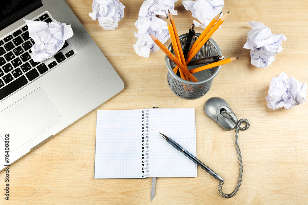 Working mess with crumpled paper and notebook Stock Photo | Adobe Stock