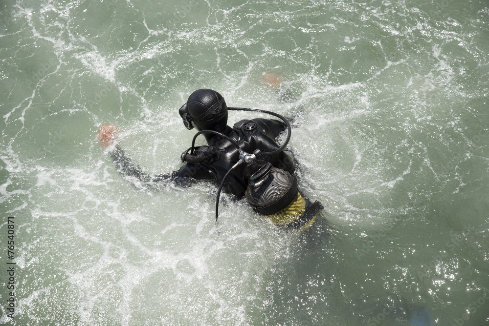 Commercial diver entering the water with a splash Stock Photo | Adobe Stock