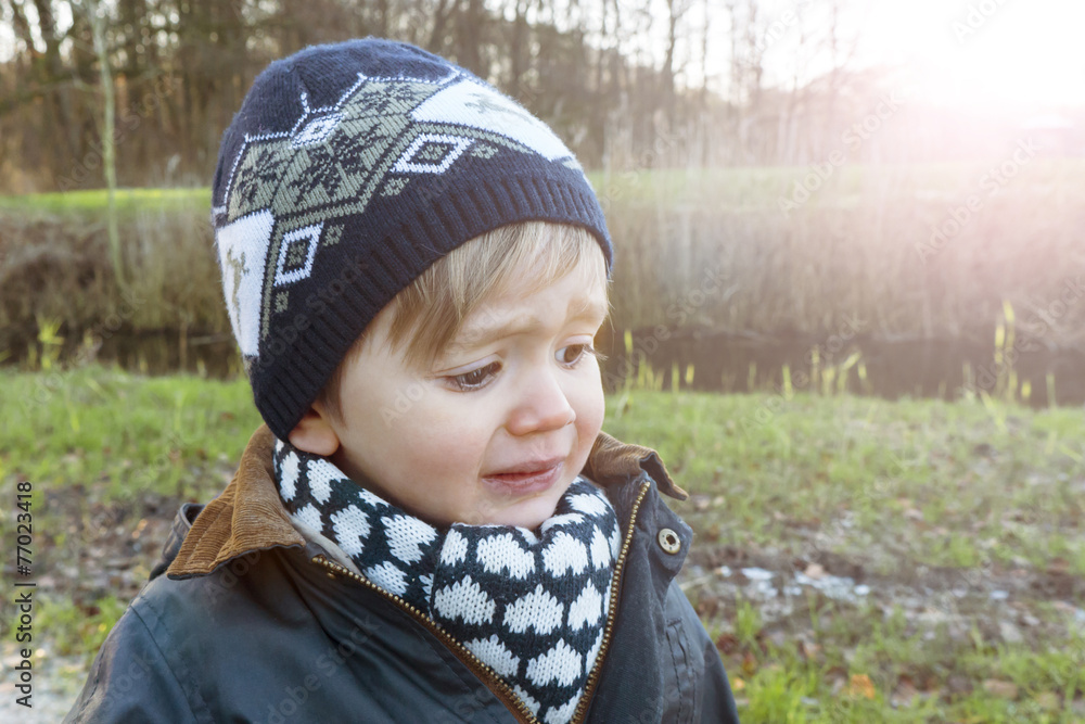 beautiful boy crying outdoors Stock Photo | Adobe Stock