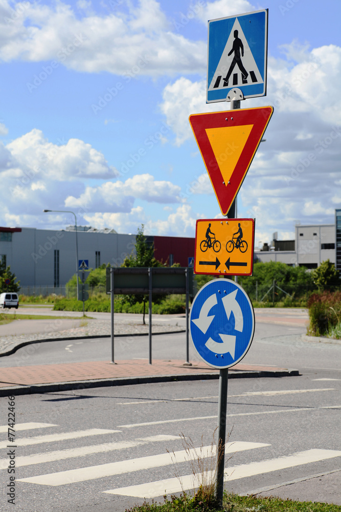 road signs at intersection roundabout Stock Photo | Adobe Stock